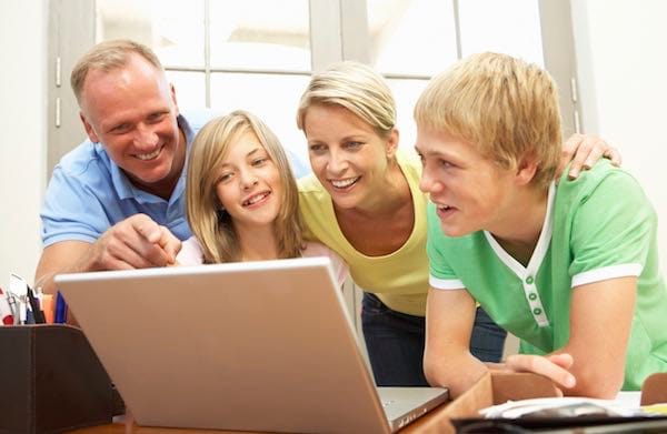 Family Using Laptop At Home - Tech Guide